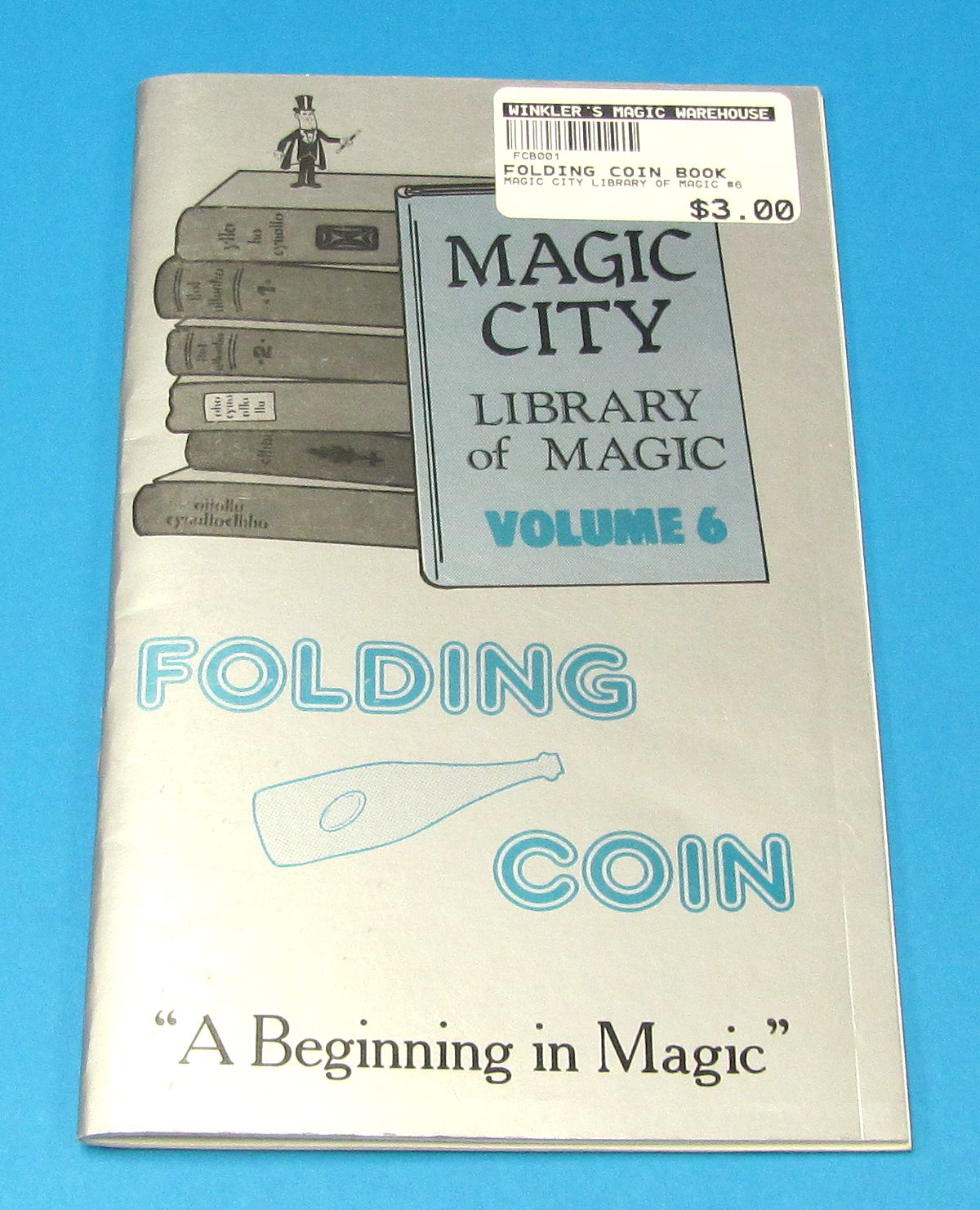 Folding Coin #6 (Magic City Library of Magic) | Winkler's Magic Warehouse